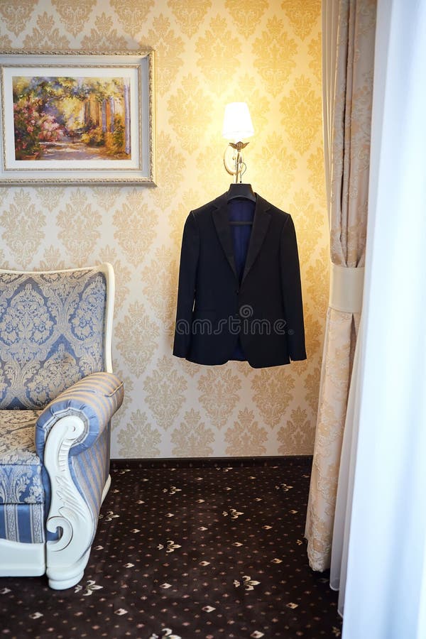 Men`s Suit Hanging in the Room Stock Photo - Image of garment, beauty ...