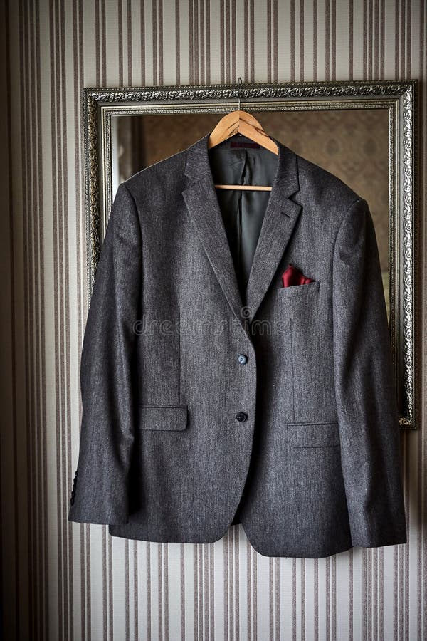 Men`s Suit Hanging in the Room Stock Photo - Image of clothing ...