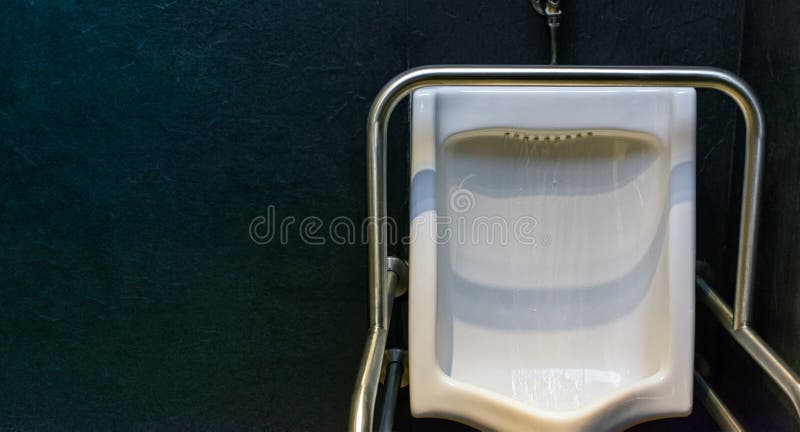 Men`s Urinal with a Support Bar for Handicap. Editorial Stock Photo ...