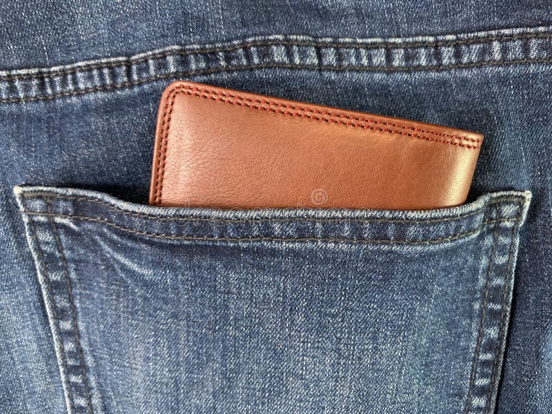 Men`s Wallet in the Back Pocket of Jeans. Leather Brown Wallet in Blue ...