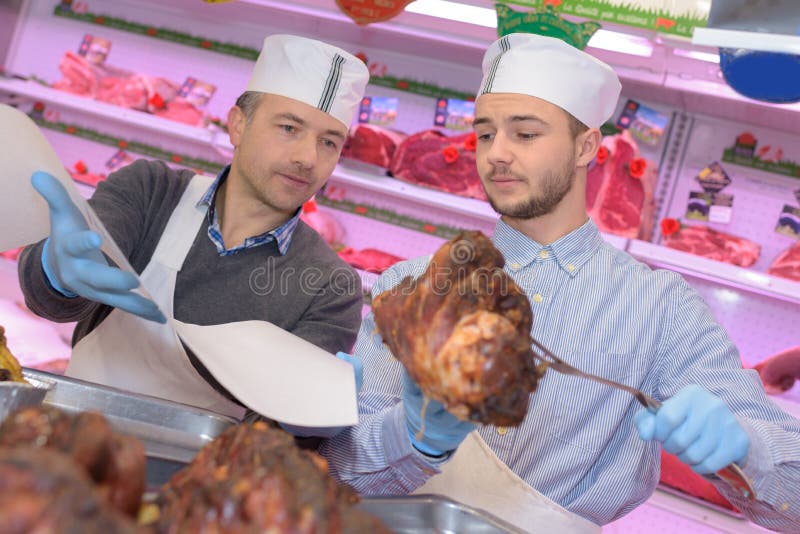Men serving cooked meat stock image. Image of tasty - 118889191