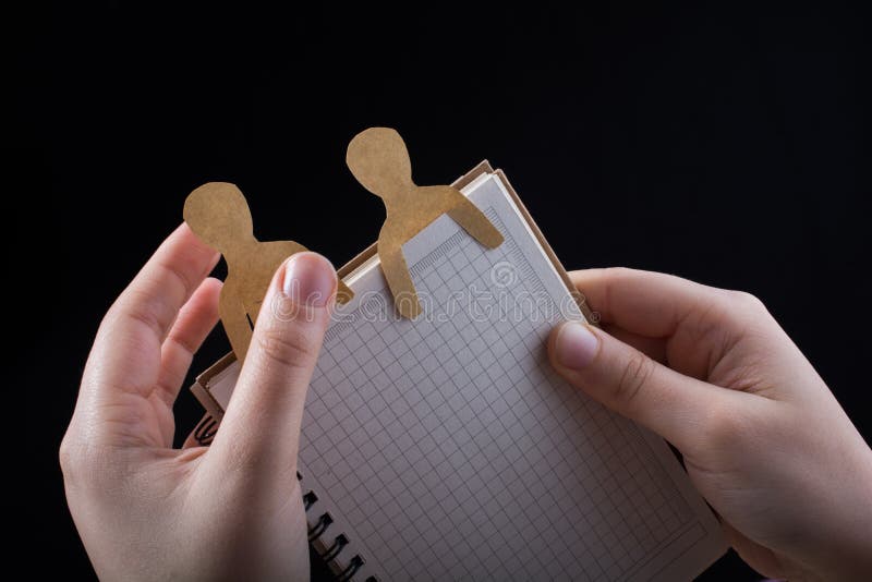 Men Shape Cut Out of Paper in Notebbok Stock Image - Image of ...
