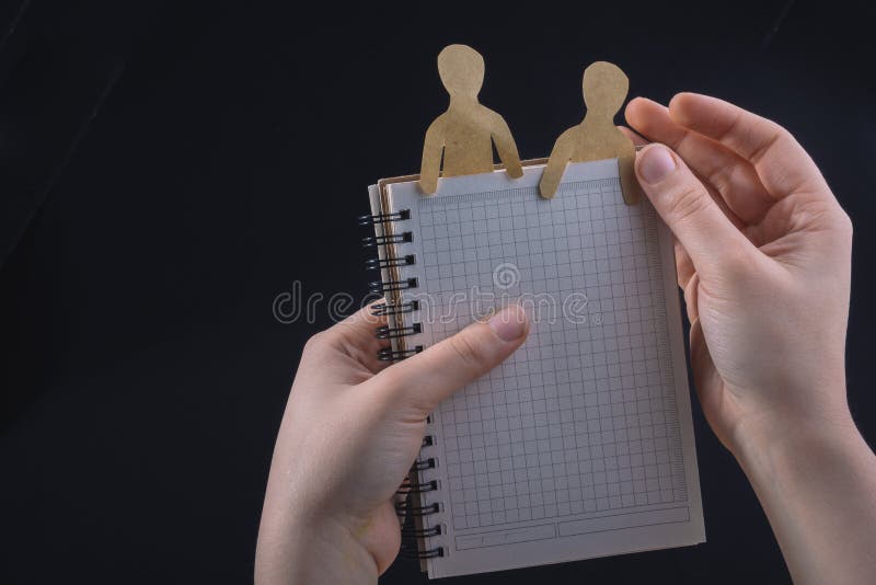 Men Shape Cut Out of Paper in Notebbok Stock Image - Image of ...