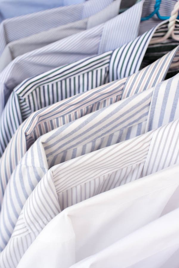 Men Shirts Hanging on Rack in a Row, Selective Focus Stock Photo ...