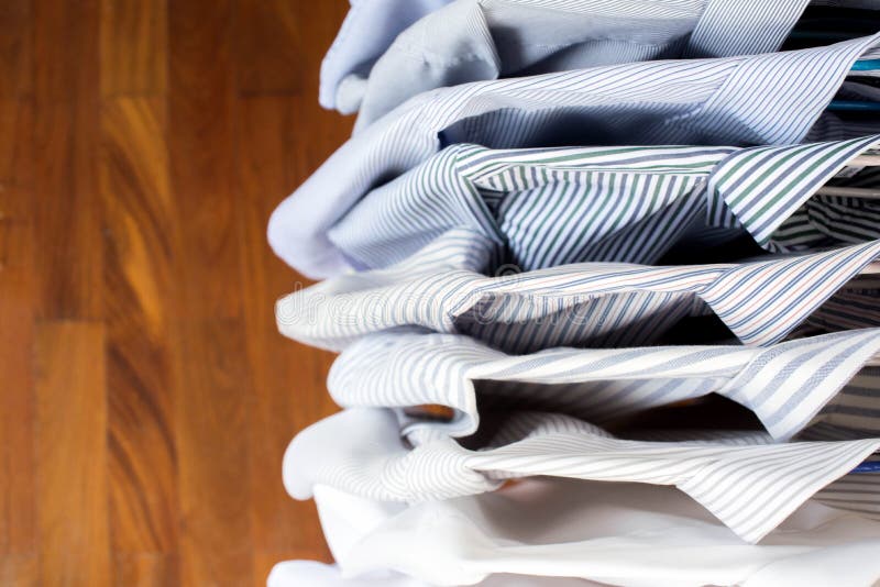 Men Shirts Hanging on Rack in a Row, Top View Stock Photo - Image of ...