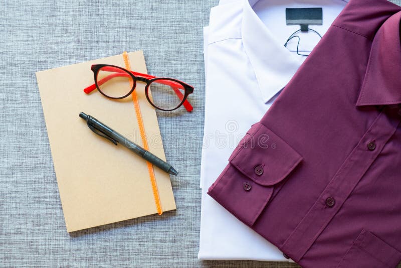 Men Shirts with Notebook, Pen and Glasses Personal Stuff on Table Stock ...