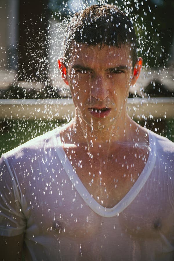 Men Showering Outside and Looking in To Camera Stock Photo - Image of ...