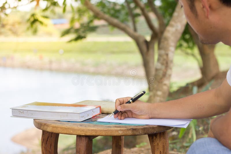 Men Sit and Use Pens on Notebooks Stock Photo - Image of education ...