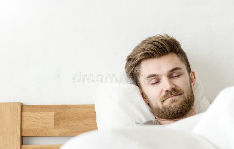 Men sleep on bed stock image. Image of night, people - 94998171
