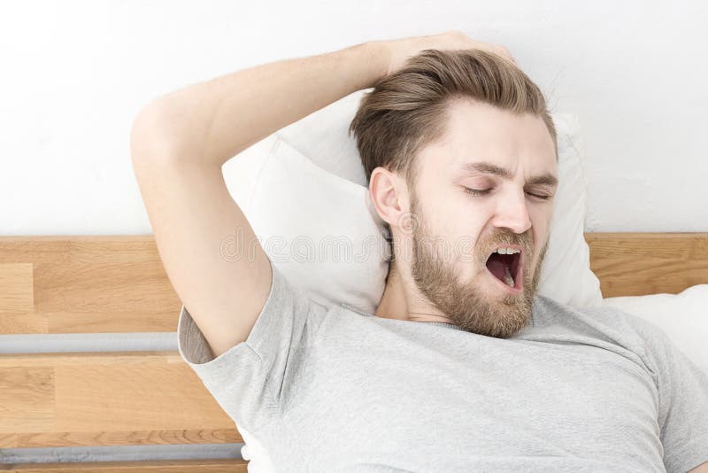 Men sleep on bed stock image. Image of night, people - 94998171