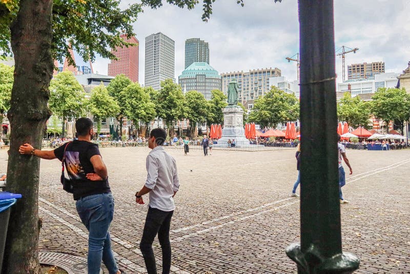 Men on Square Den Haag with Skyscraper View Editorial Stock Photo ...