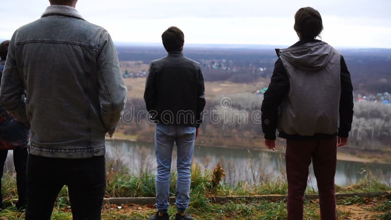 Men Stand Motionless and Look into the Distance. Group of People Look ...