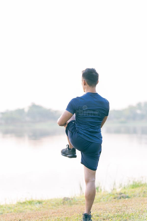Men Stretching for the Start of a Marathon, Training or Exercise ...