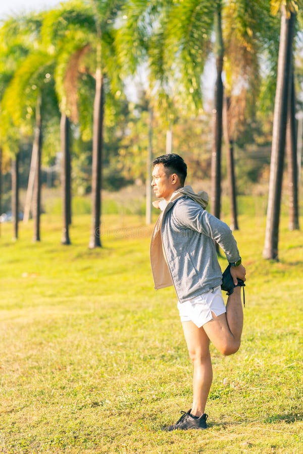 Men Stretching for the Start of a Marathon, Training or Exercise ...