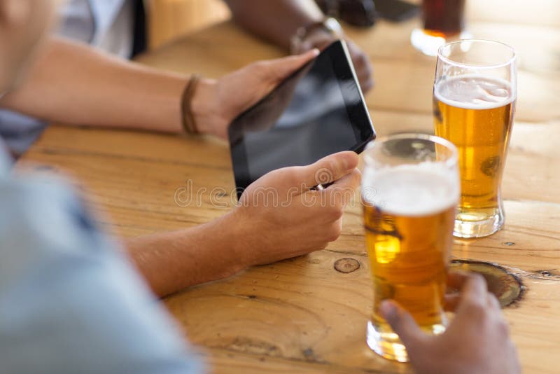 Men with Tablet Computer Drinking Beer at Bar Stock Image - Image of ...