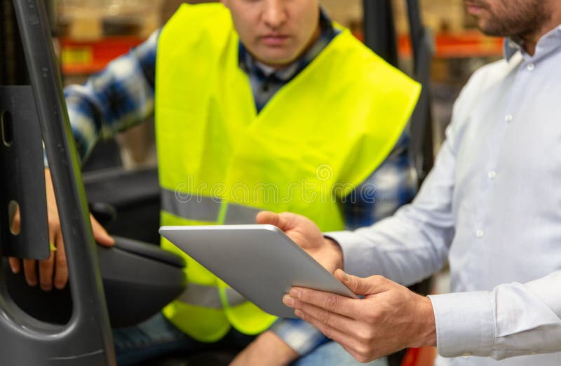 Men with Tablet Pc and Forklift at Warehouse Stock Image - Image of ...