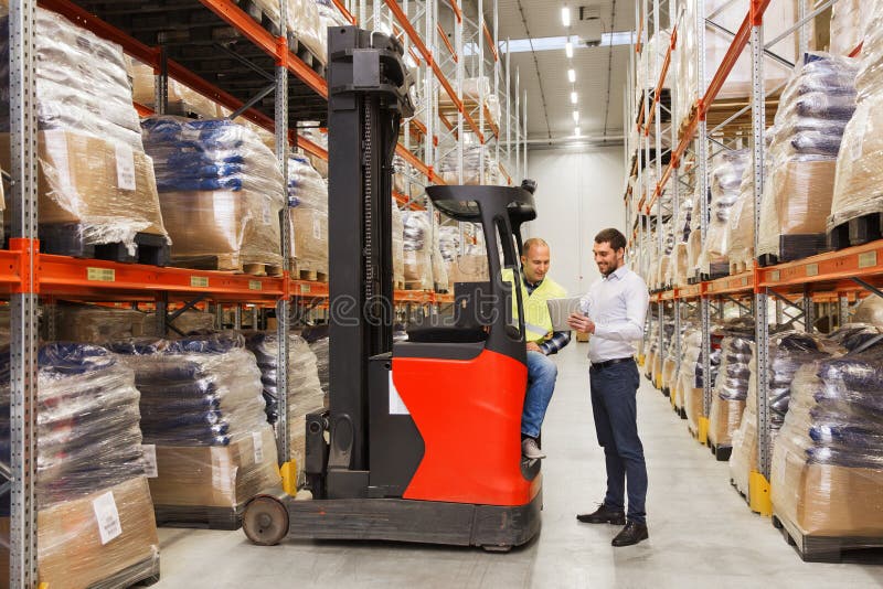 Men with Tablet Pc and Forklift at Warehouse Stock Photo - Image of ...