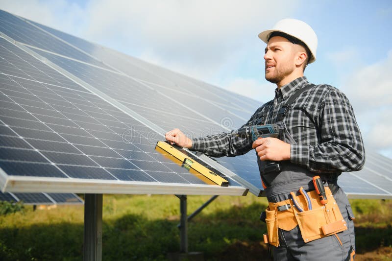 Men Technicians Installing Photovoltaic Solar Moduls. Concept of ...