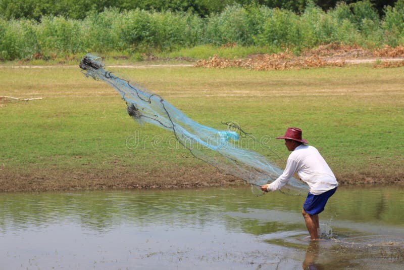 Men Throw a Net on the River. Editorial Stock Photo - Image of green ...