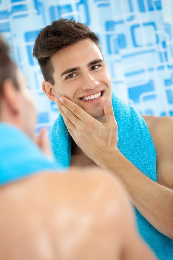 Men Touching His Soft Cheek Stock Photo - Image of reflection, beauty ...