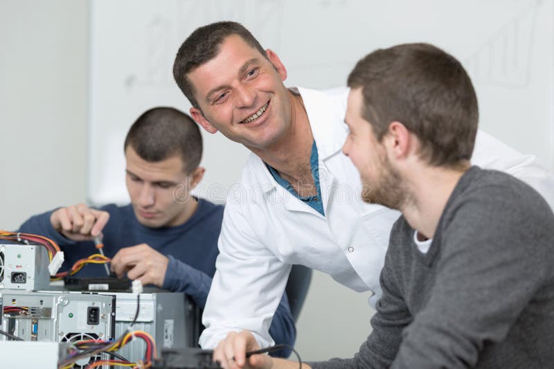 Men trying to fix computer stock image. Image of hardware - 270838771