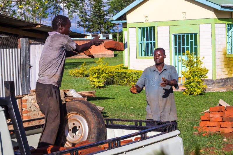 Men unloading pickup truck editorial stock image. Image of vehicle ...