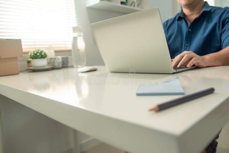 Men are Using Laptops on Their Dining Tables at Home. Stock Image ...
