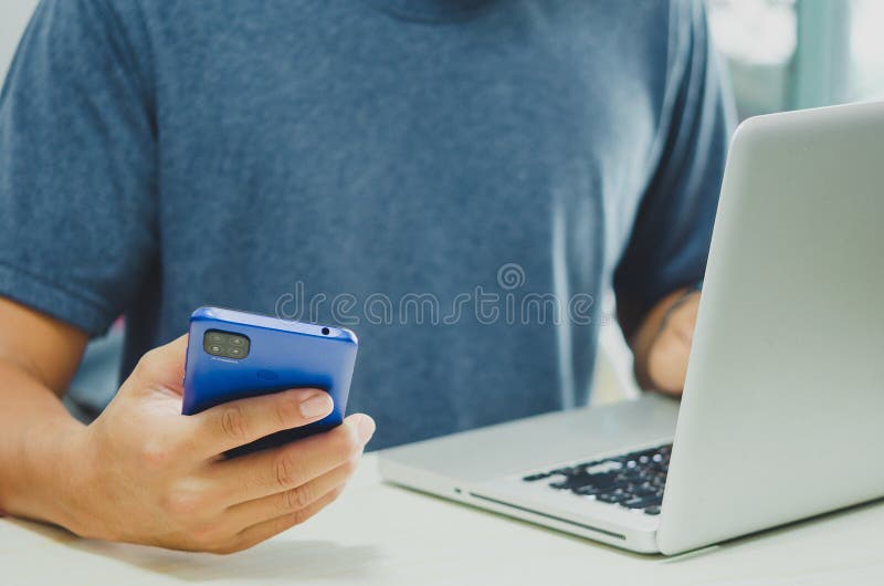 Men Using Mobile and Computers are Working on Searching for Information ...