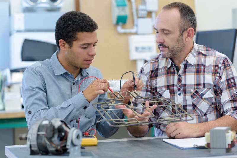 Men Using Multimeter To Test Heating Element Stock Photo - Image of ...