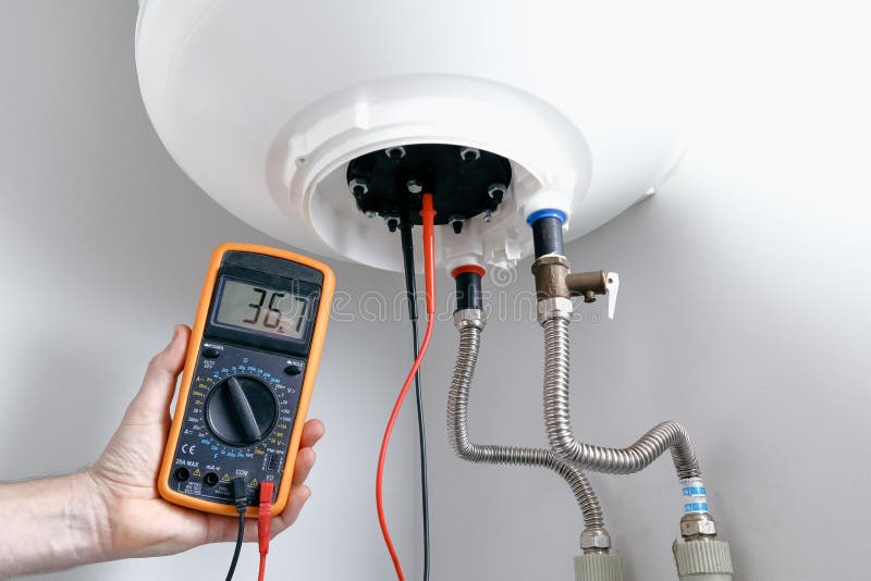 Men Using Multimeter To Test Heating Element. Appliance Engineer Using ...