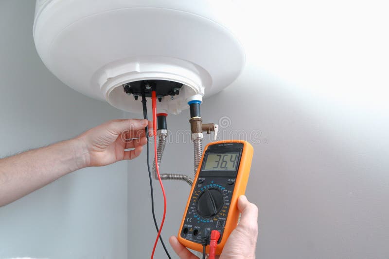 Men Using Multimeter To Test Heating Element. Appliance Engineer Using ...