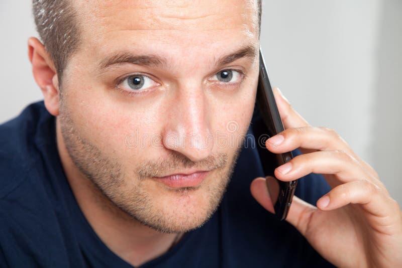 Men using a smart phone stock image. Image of people - 53907115