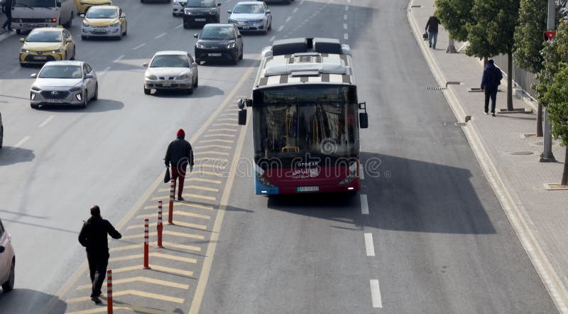 Men Walk beside a Bus Rapid Transit Editorial Photo - Image of driving ...