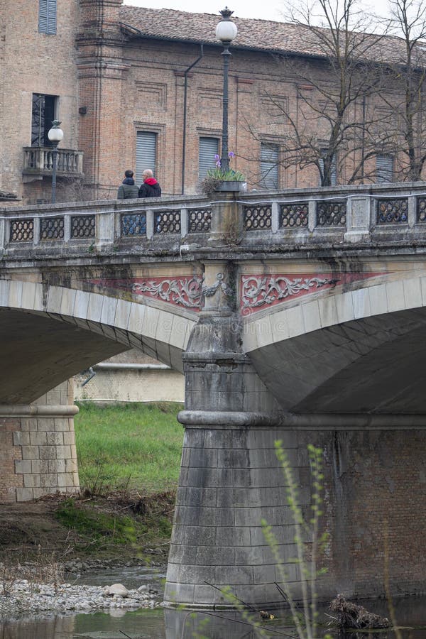 Men Walking on the Bridge in the Center of Parma on a Spring Day, Italy ...