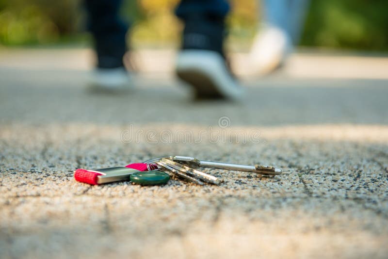 Men Walking Outside, Focus on Lost Keys Stock Image - Image of ...