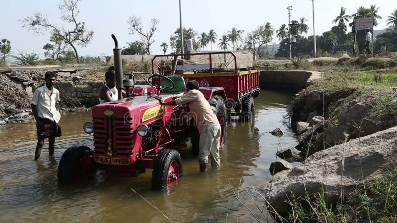 Men Washing Tractor Parked in a River. Stock Footage - Video of ...