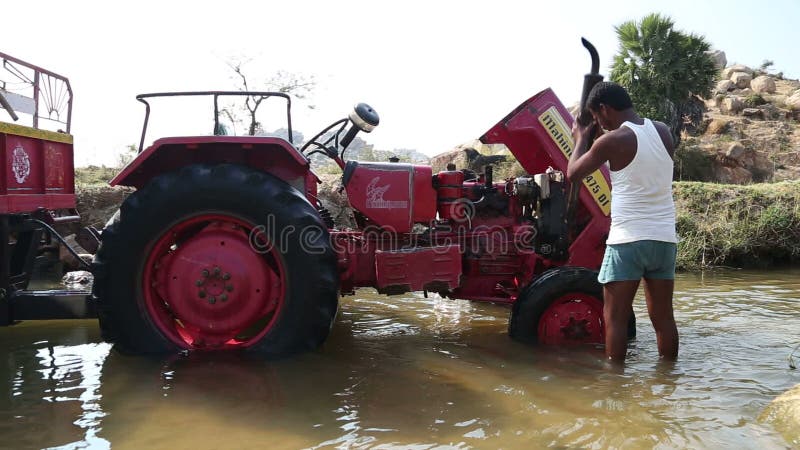 Men Washing Tractor Parked in a River. Stock Footage - Video of ...
