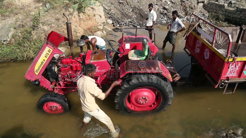Men Washing Tractor Parked in a River. Stock Footage - Video of ...