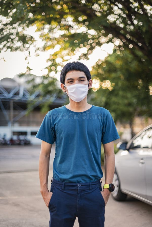Men Wearing a Face Mask To Protect Against Coronavirus Stock Photo ...
