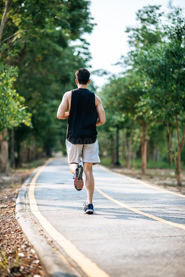 Men and Women Exercise by Running on the Road Stock Image - Image of ...