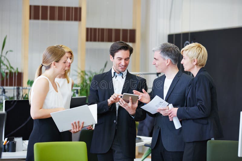 Men and Women in Office with Tablet PC Stock Photo - Image of ...