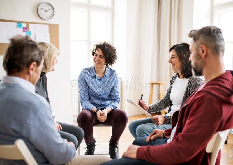 Men and Women Sitting in a Circle during Group Therapy, Talking. Stock ...