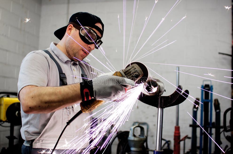 Men at work grinding steel stock image. Image of mechanic - 23887157