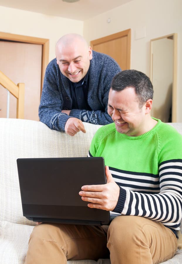 Men at work on laptop stock photo. Image of smiling, sitting - 50392704