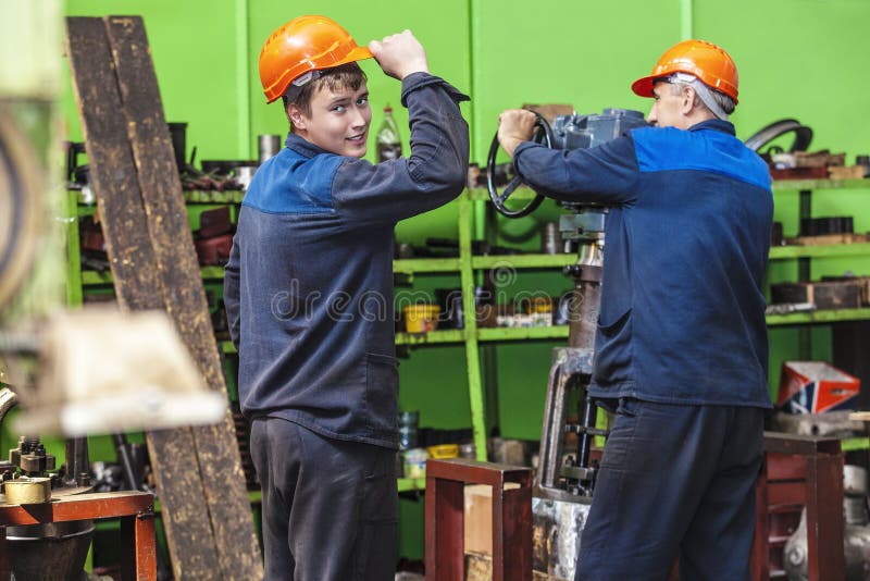 Men Work on the Old Factory for the Installation of Equipment Stock ...