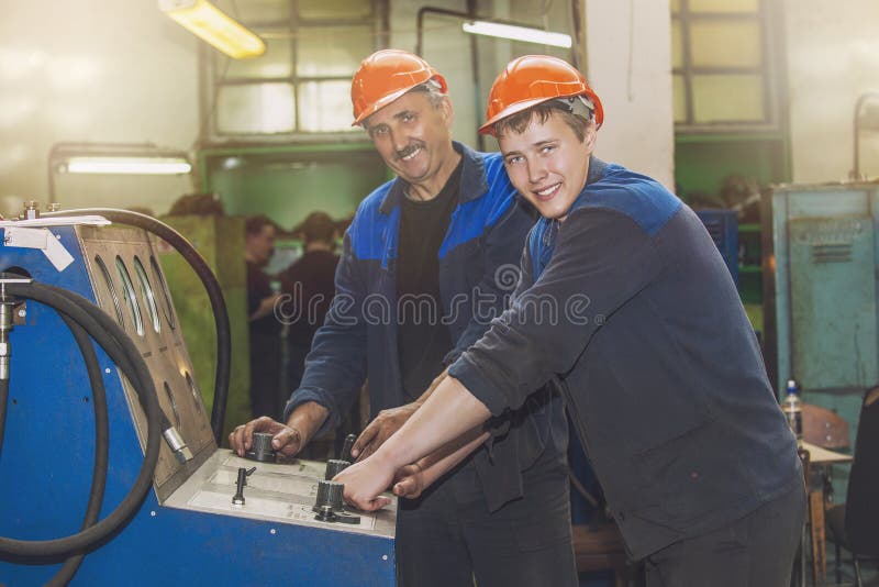 Men Work on the Old Factory for the Installation of Equipment Stock ...