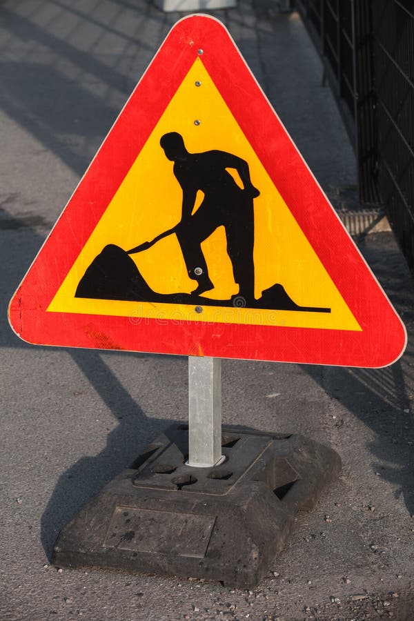 Men at Work, Road Under Construction Sign Stock Photo - Image of signal ...