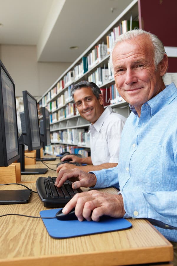 Men Working on Computers in Library Stock Photo - Image of adult, male ...