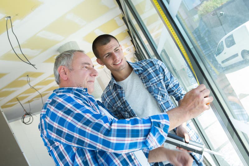 Men Working at Construction Site Stock Image - Image of practical ...