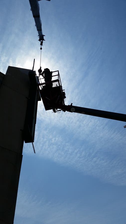 Men Working overhead stock photo. Image of demolition - 77685068